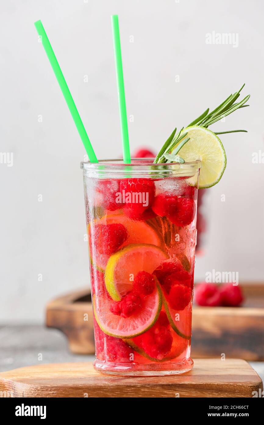 Glass of cold raspberry tea on table Stock Photo - Alamy