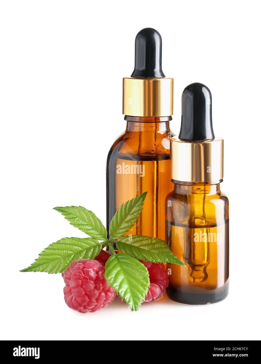 Bottles of raspberry essential oil on white background Stock Photo - Alamy