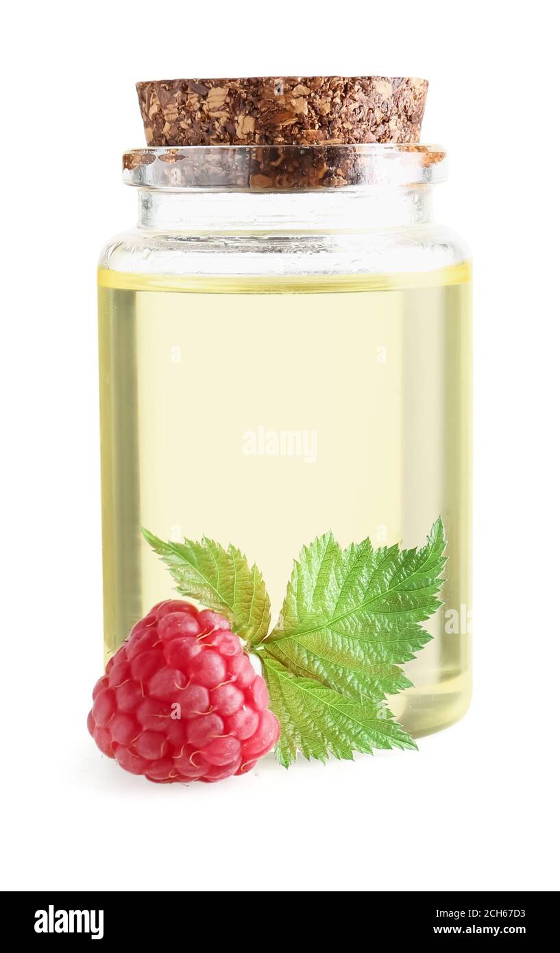 Bottle of raspberry essential oil on white background Stock Photo - Alamy
