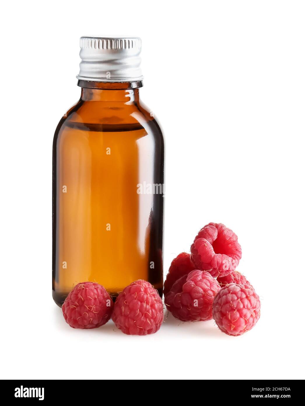 Bottle of raspberry essential oil on white background Stock Photo - Alamy