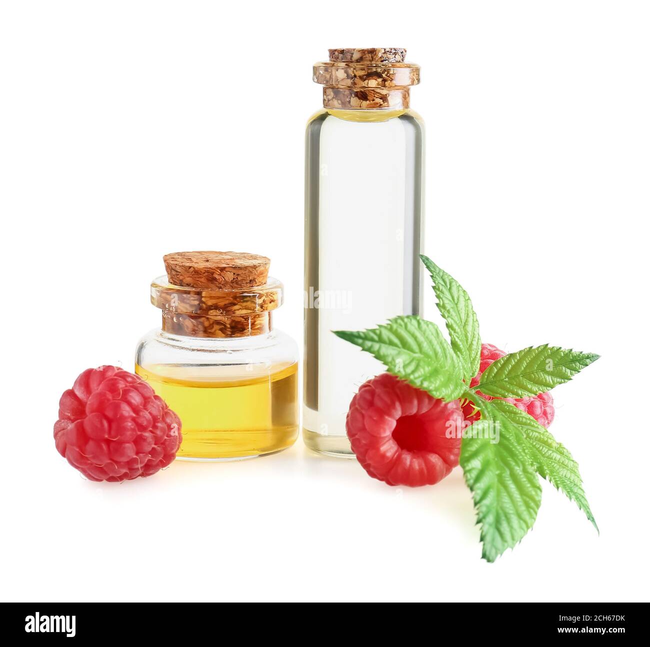 Bottles of raspberry essential oil on white background Stock Photo - Alamy