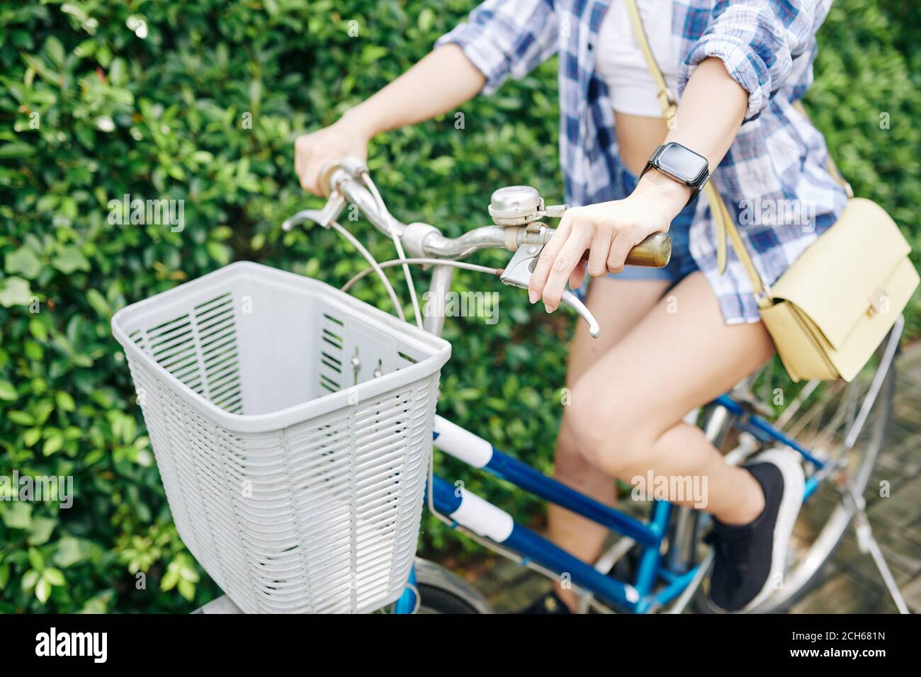 Young woman riding bicyle Stock Photo - Alamy