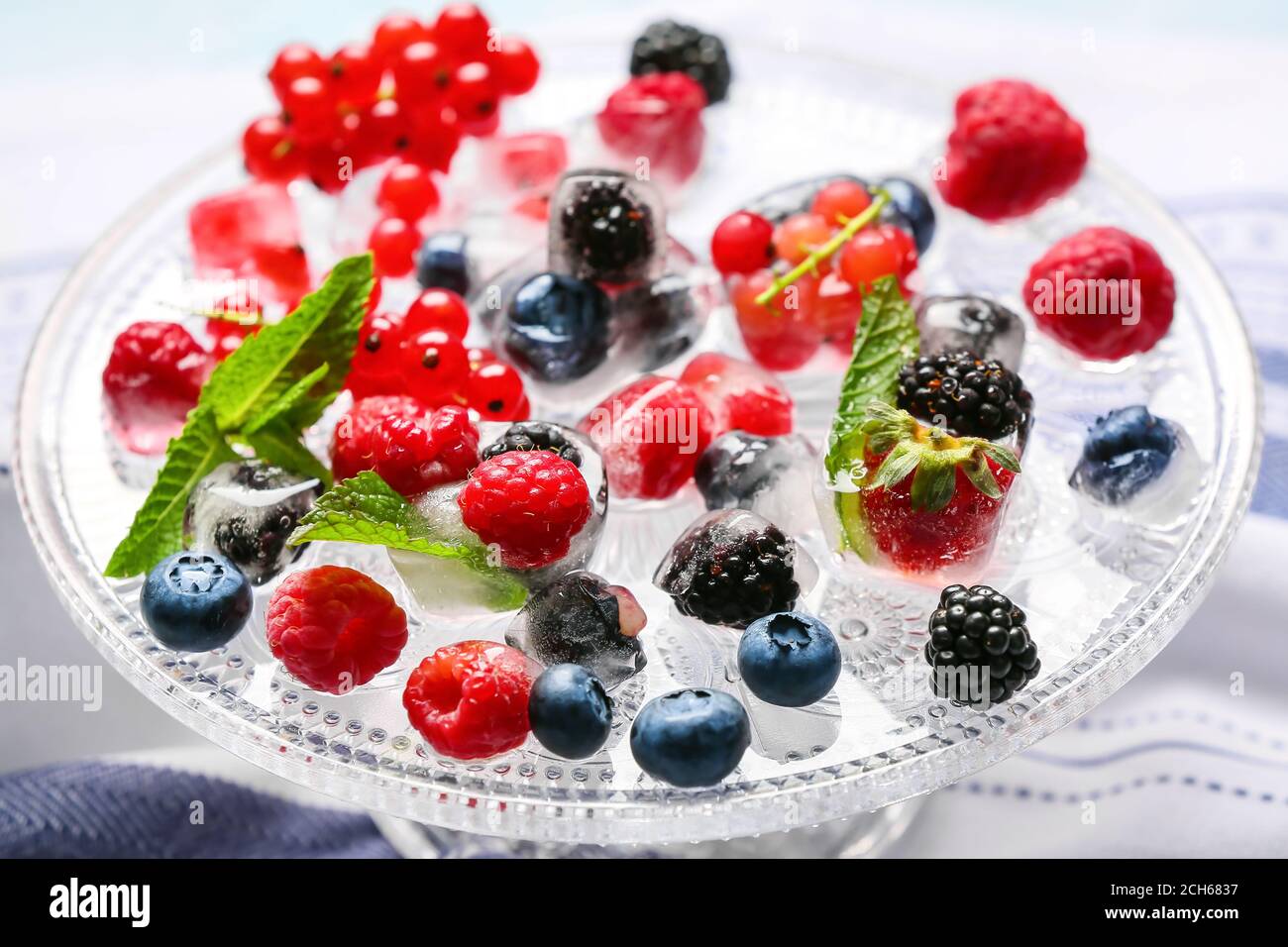 Ice with frozen berries on stand Stock Photo - Alamy