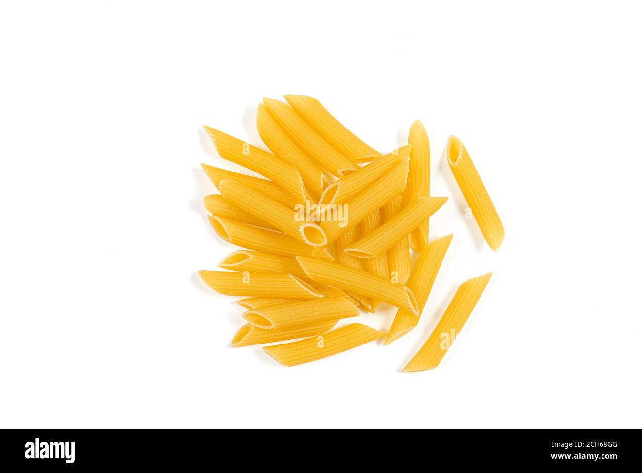 Uncooked penne pasta isolated on white background. Top view. Heap of ...
