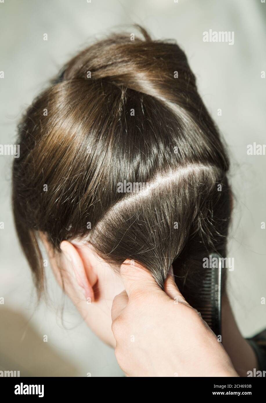 Woman brown hair back neck hi-res stock photography and images - Alamy