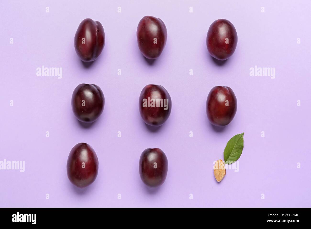 Tasty sweet plums on color background Stock Photo - Alamy