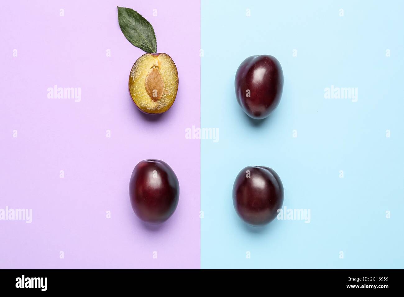 Tasty sweet plums on color background Stock Photo - Alamy