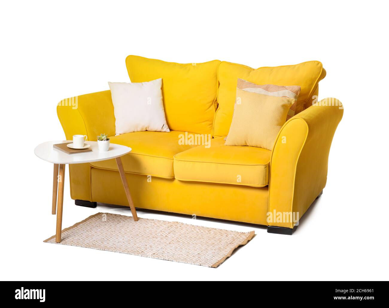 Stylish sofa and table on white background Stock Photo - Alamy