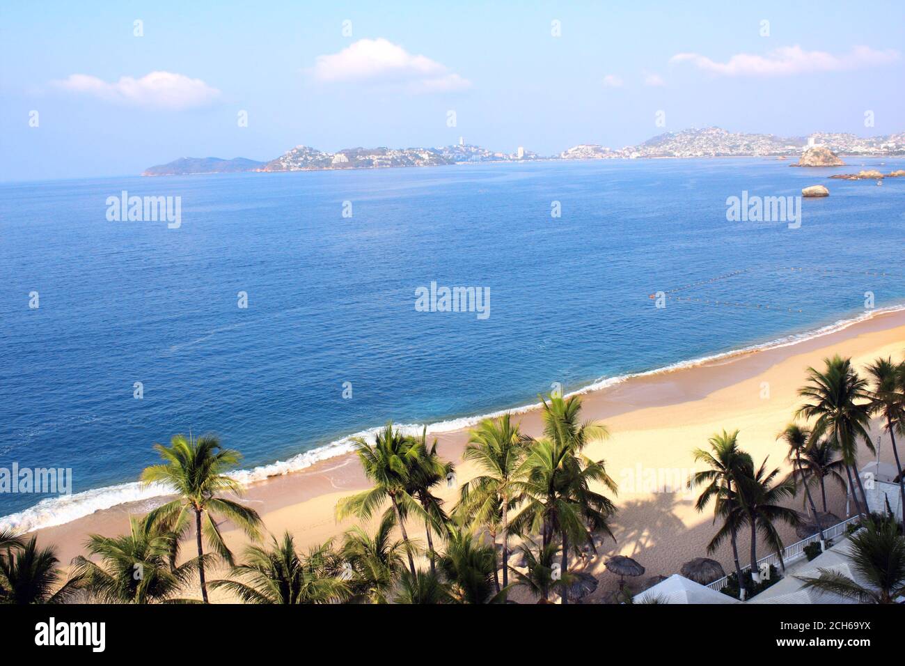 Aerial view on palms, ocean waves and beach, Acapulco de Juarez, Mexico ...