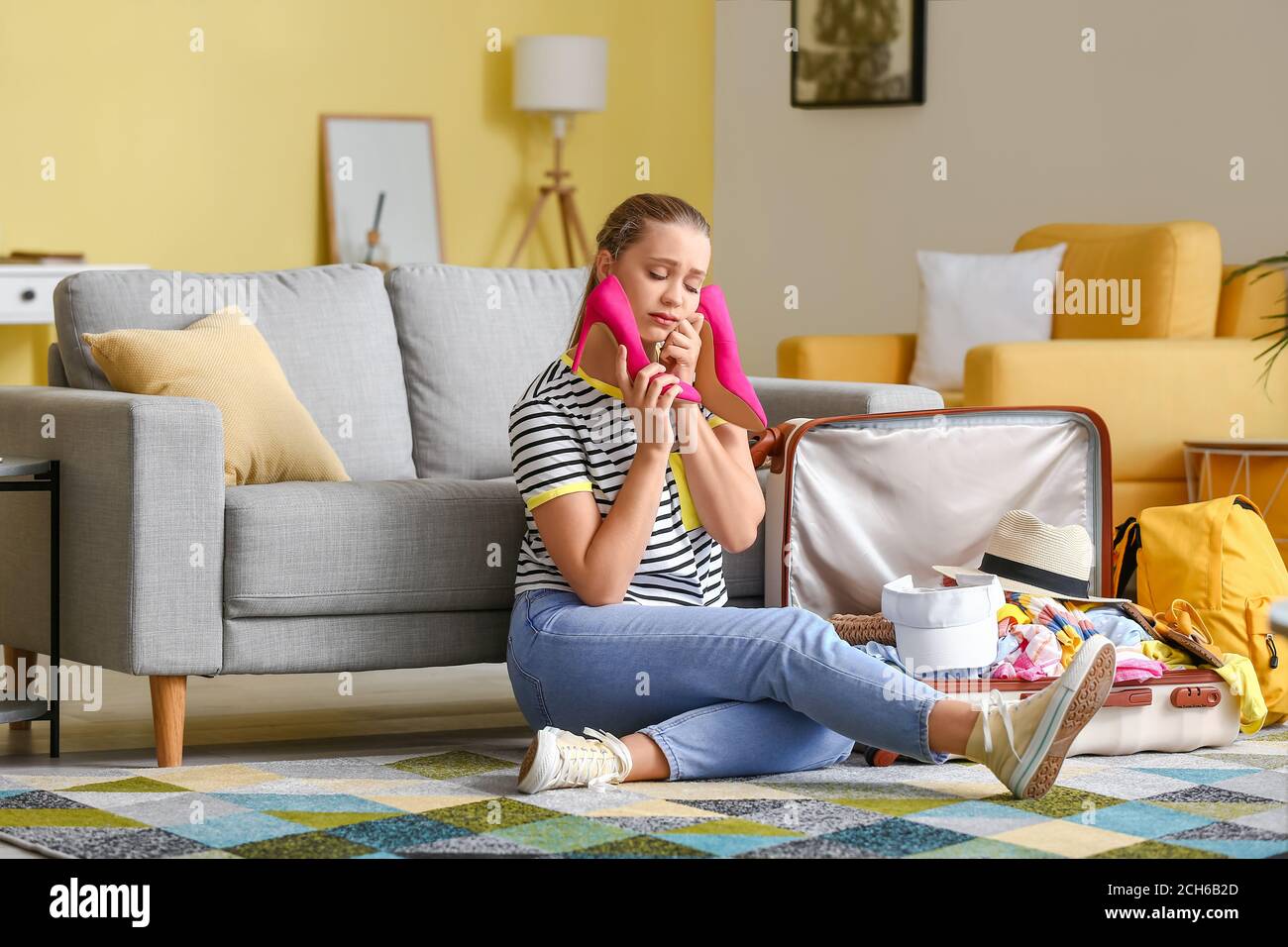 Woman packing suitcase sad hi-res stock photography and images - Alamy