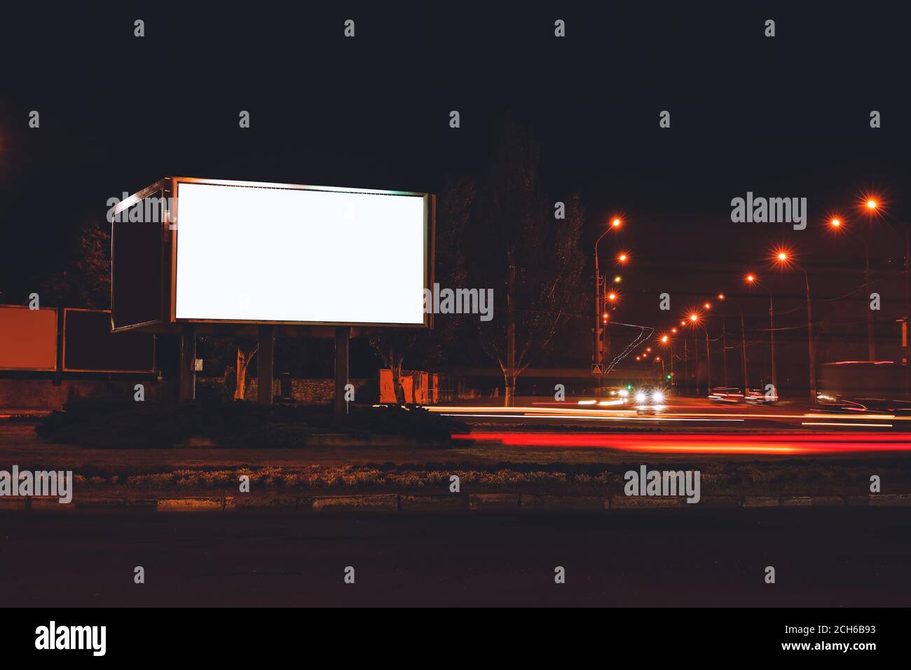 Advertising billboards at night outdoors Stock Photo - Alamy