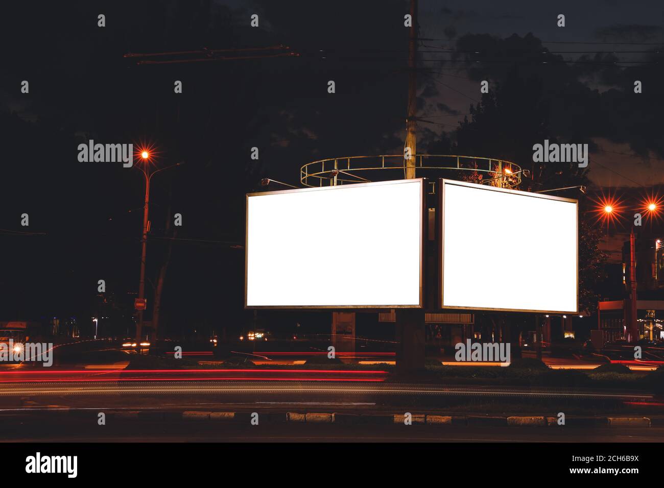 Advertising billboards at night outdoors Stock Photo - Alamy