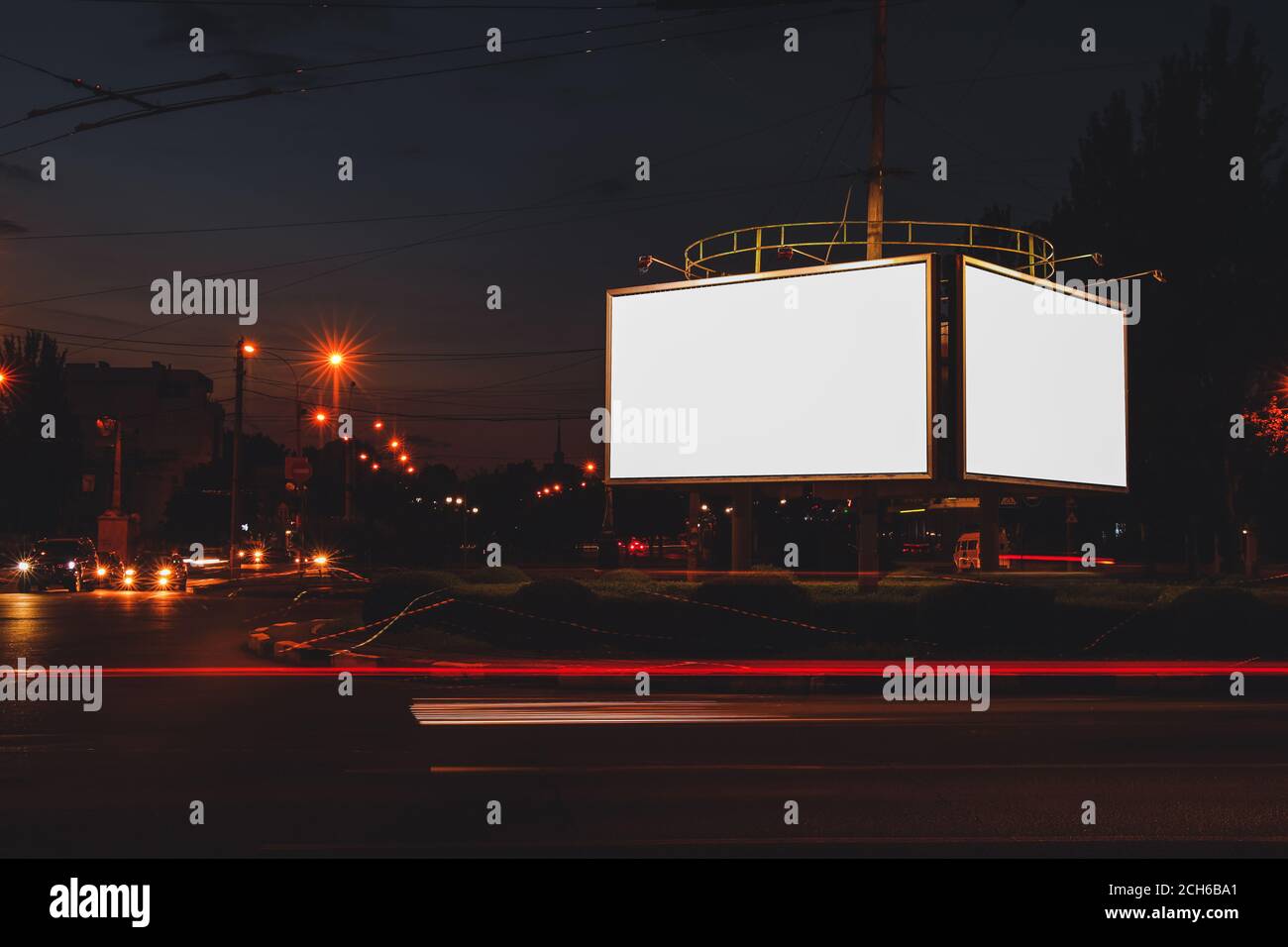 Advertising billboards at night outdoors Stock Photo - Alamy