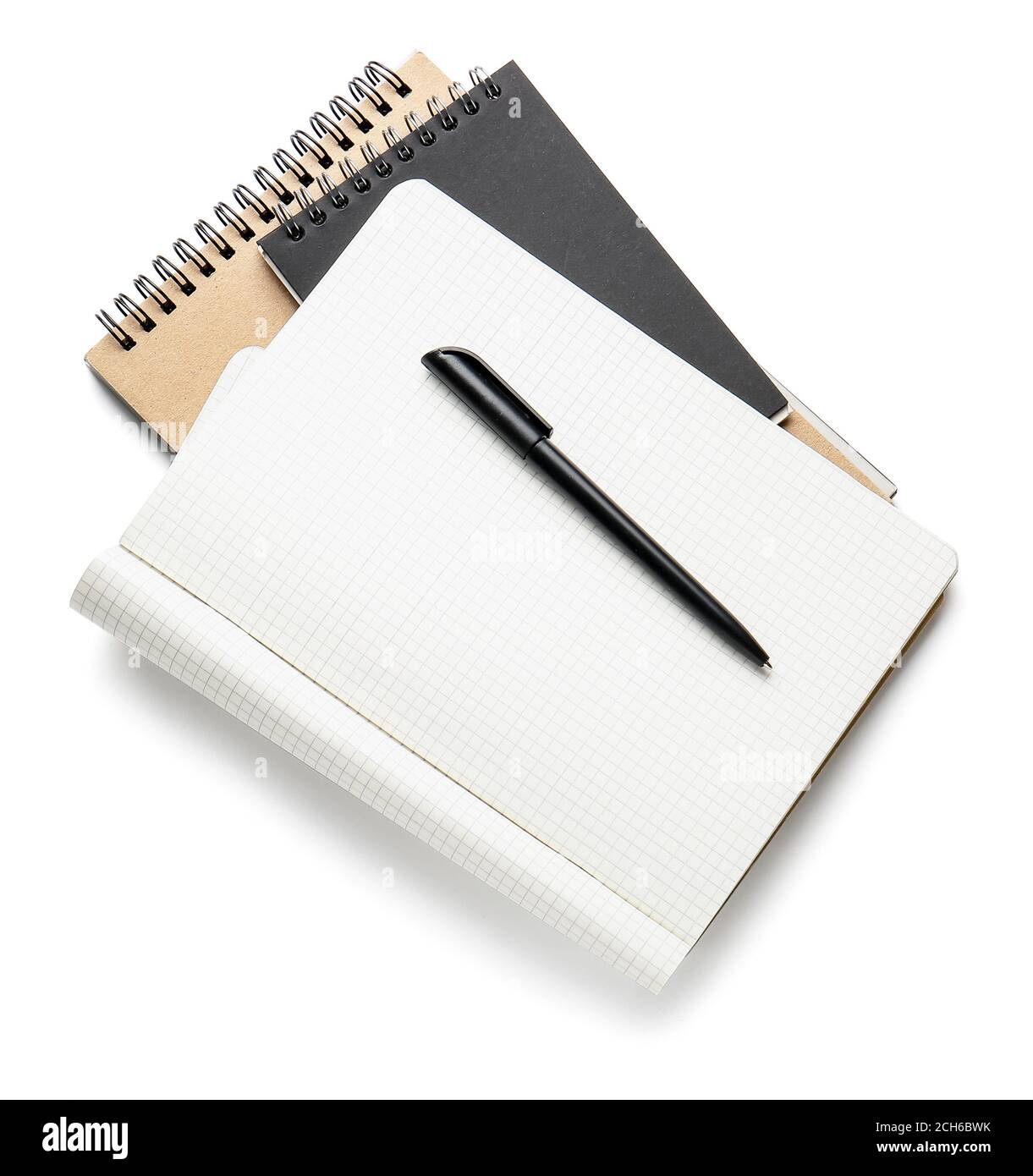 Notebooks and pen on white background Stock Photo - Alamy