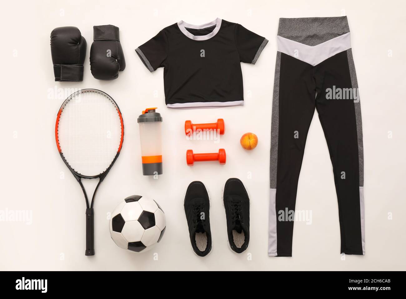 Different sports equipment with clothes on white background Stock Photo ...