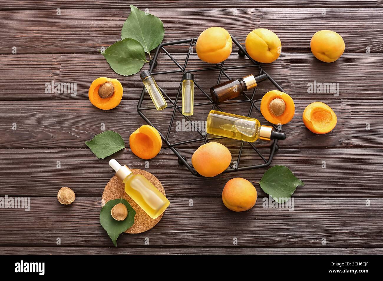 Bottles of apricot essential oil on table Stock Photo - Alamy