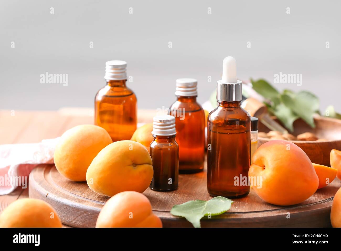 Bottles of apricot essential oil on table Stock Photo - Alamy