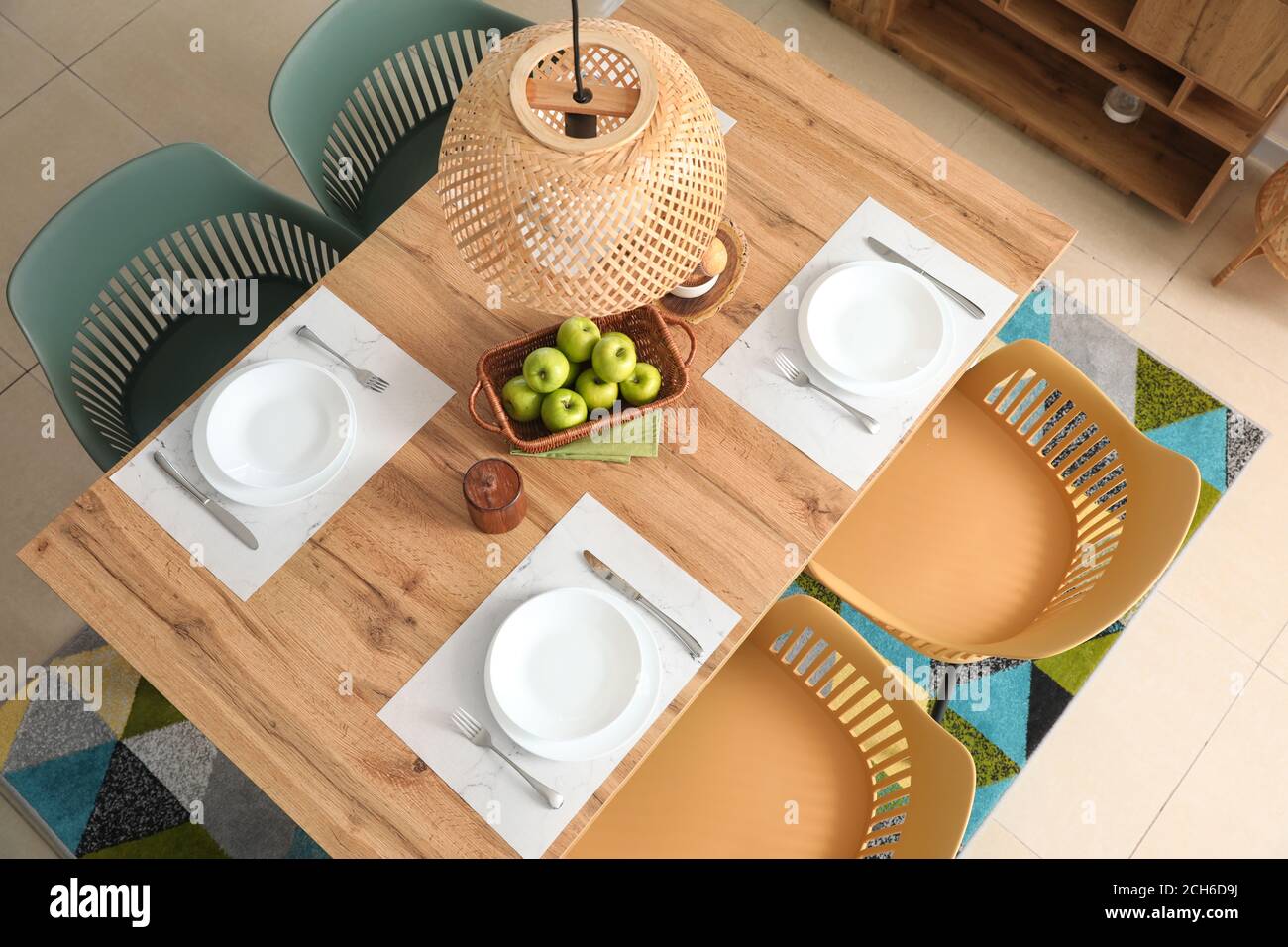 Table set in modern dining room, top view Stock Photo - Alamy