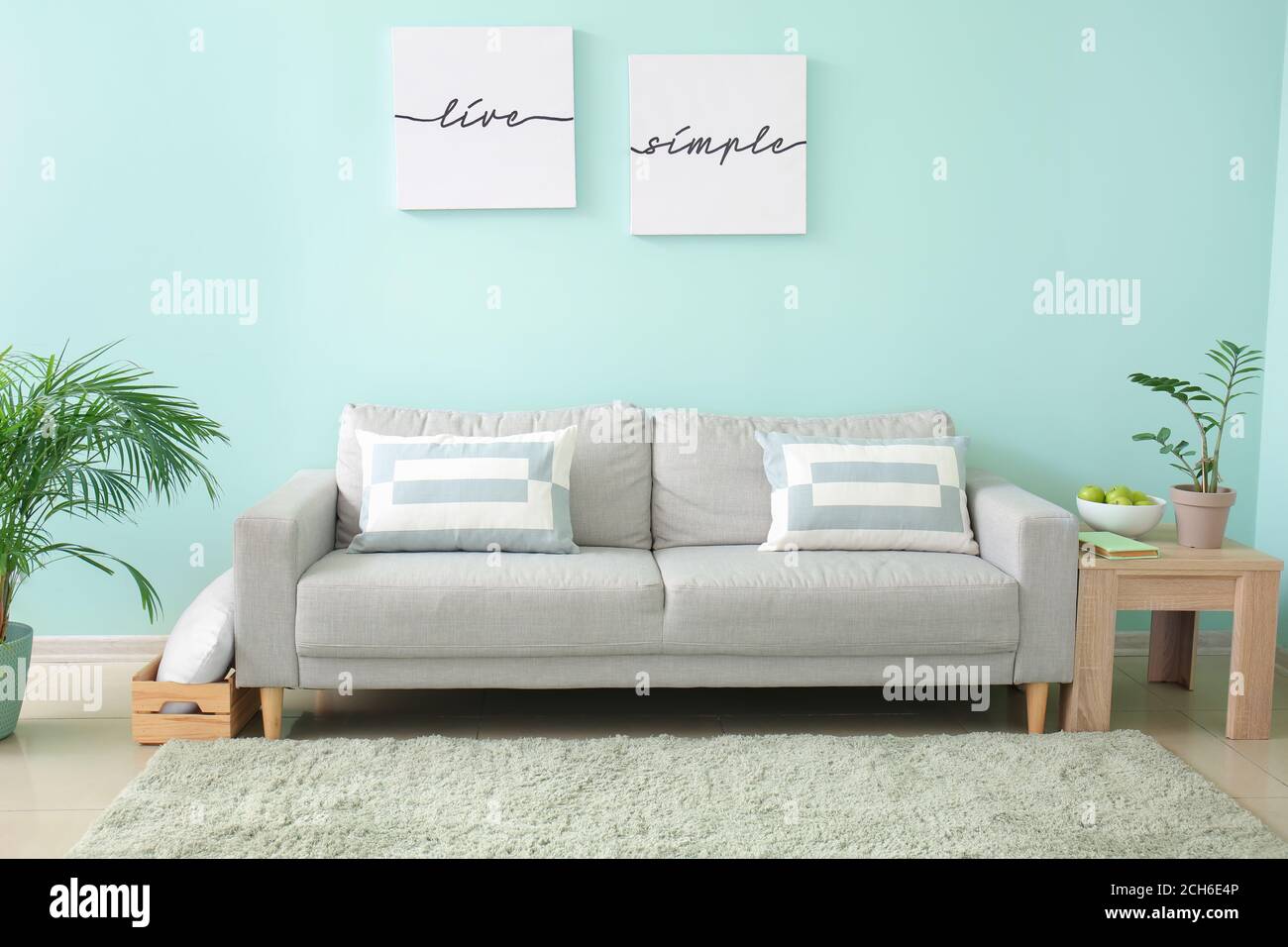 Interior of room with stylish mint wall Stock Photo - Alamy