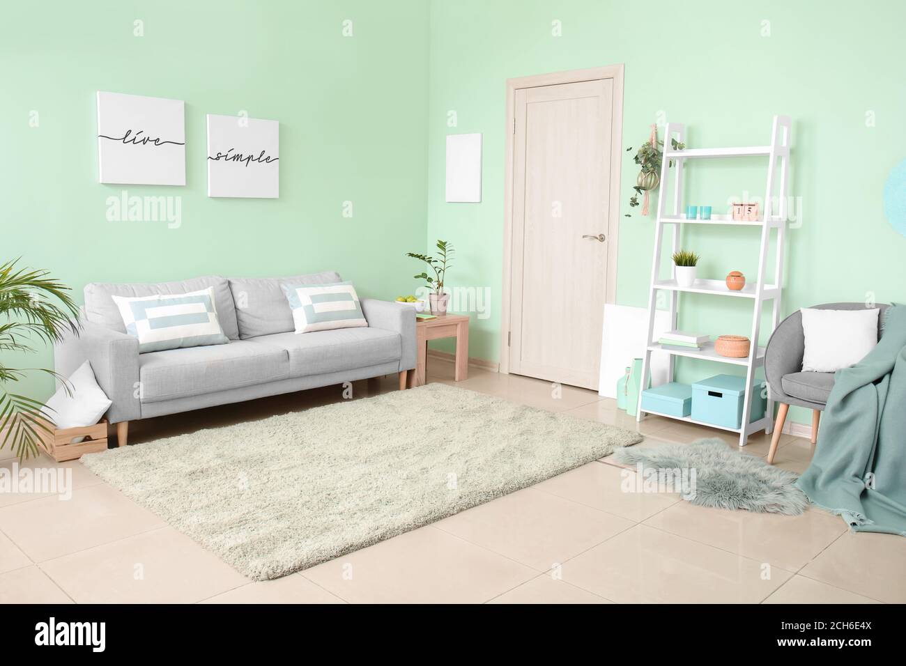 Interior of room with stylish mint wall Stock Photo - Alamy