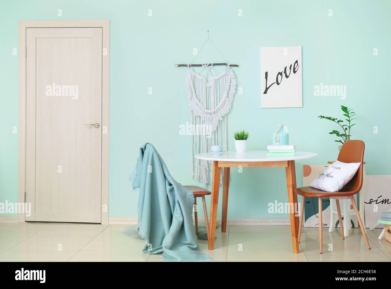 Interior of room with stylish mint wall Stock Photo - Alamy