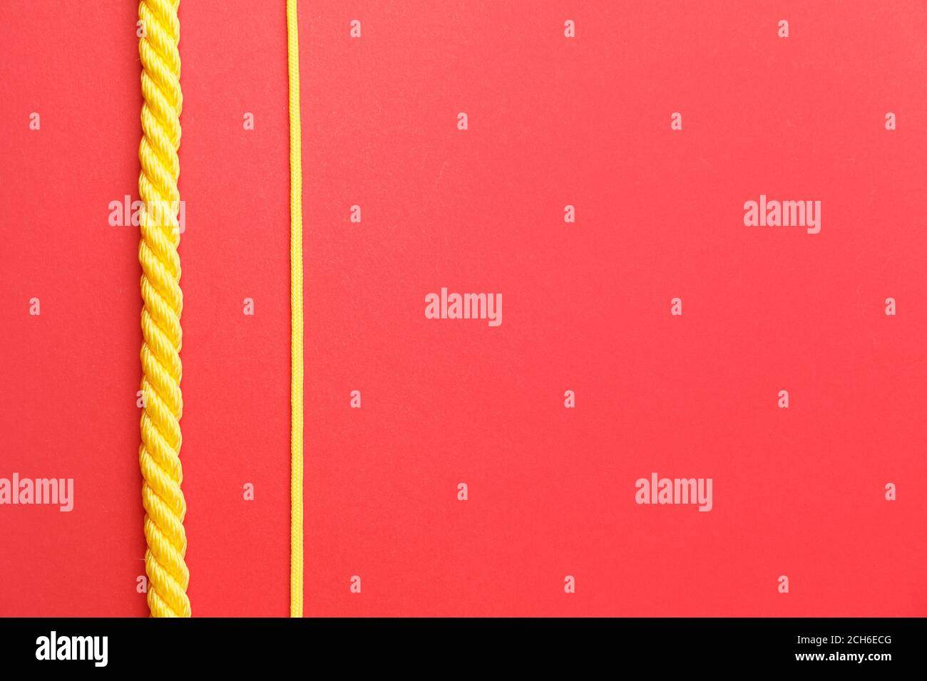 Long ropes on color background Stock Photo - Alamy