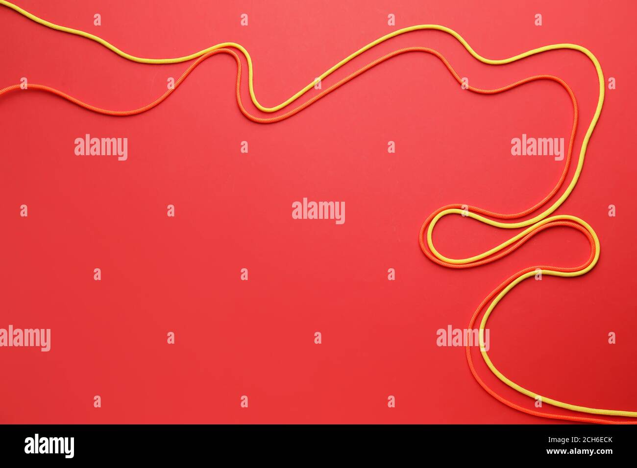 Long ropes on color background Stock Photo - Alamy