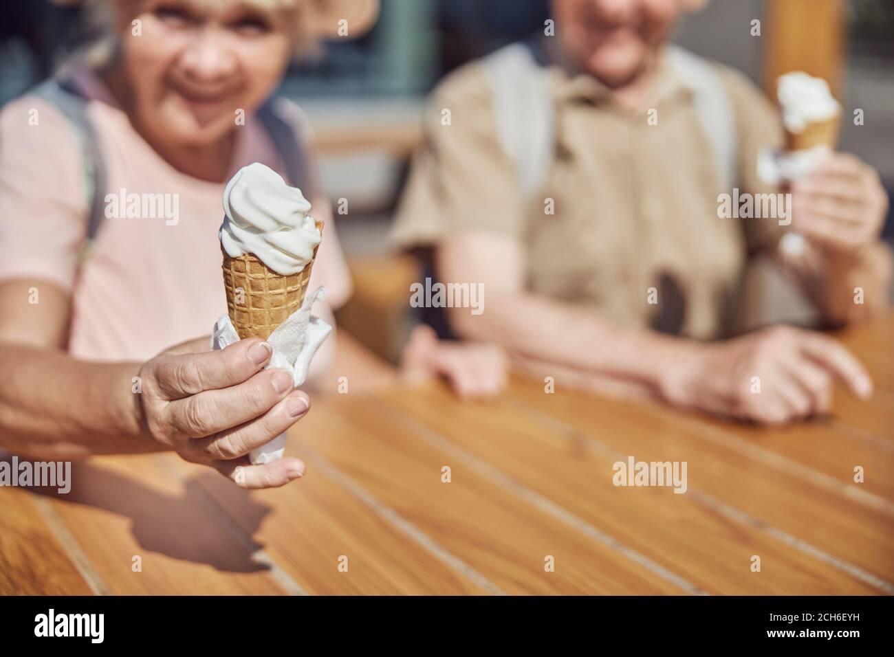 Two people holding ice hi-res stock photography and images - Alamy