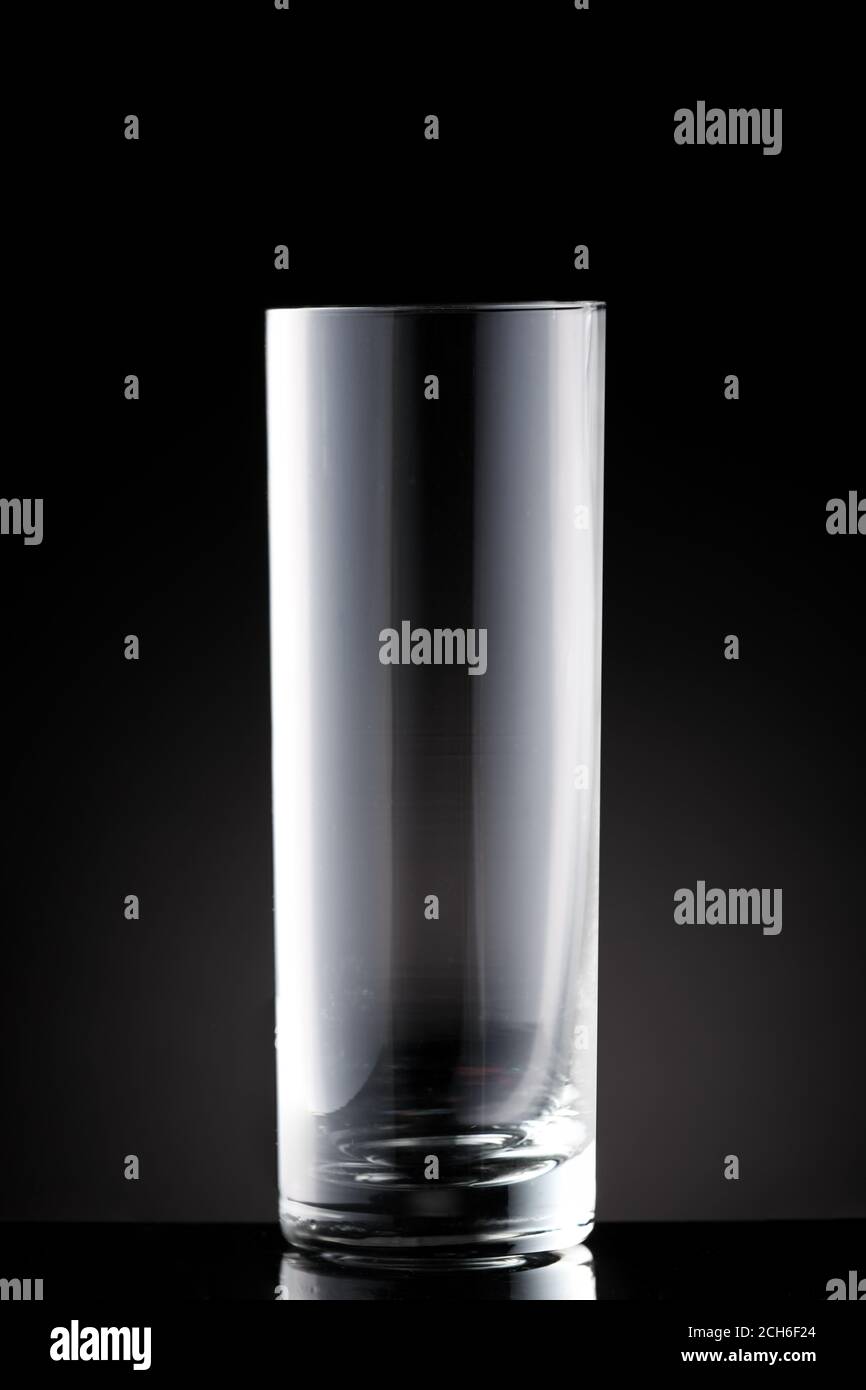 Empty glass on dark background Stock Photo - Alamy