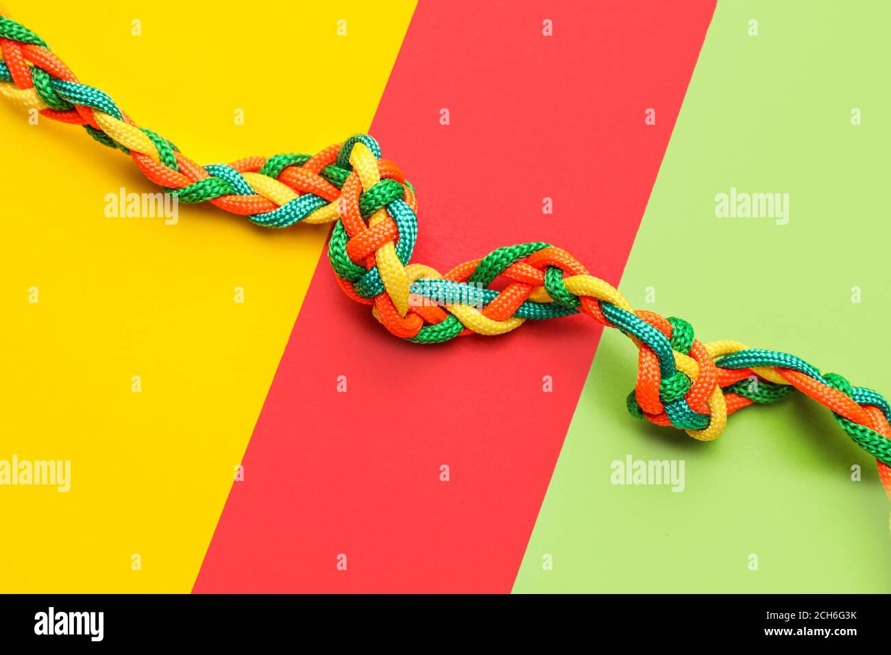Braided ropes on color background Stock Photo - Alamy