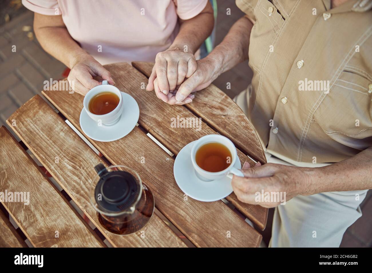 Elderly couple sitting in cafe hi-res stock photography and images - Alamy