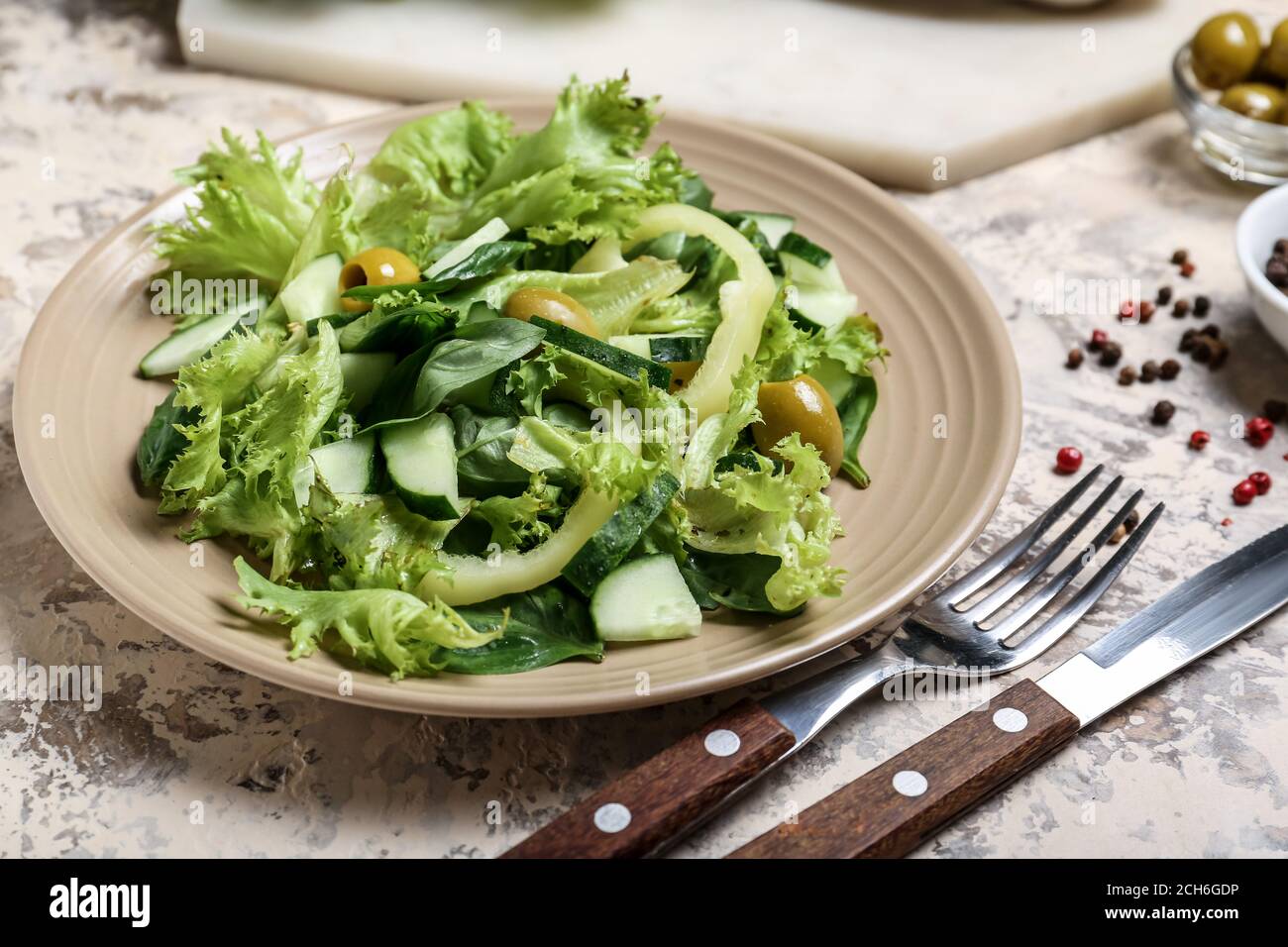 Plate with tasty cucumber salad on grey background Stock Photo - Alamy