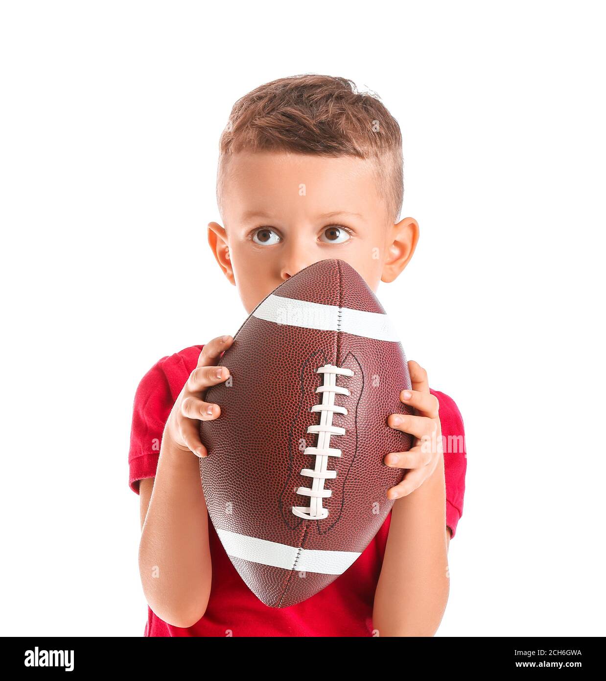 Little boy with rugby ball on white background Stock Photo - Alamy