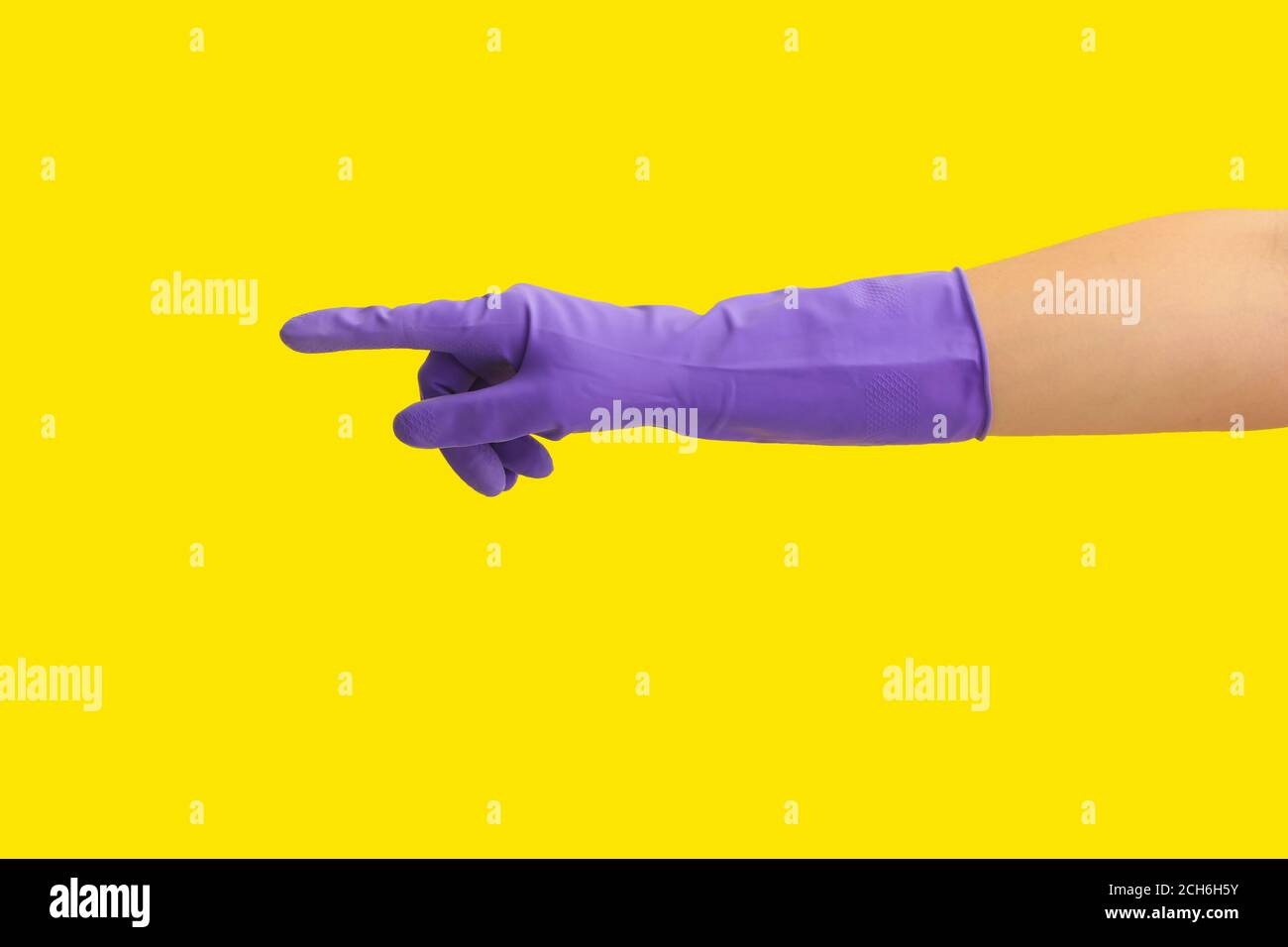 Hand in rubber glove pointing at something on color background Stock ...