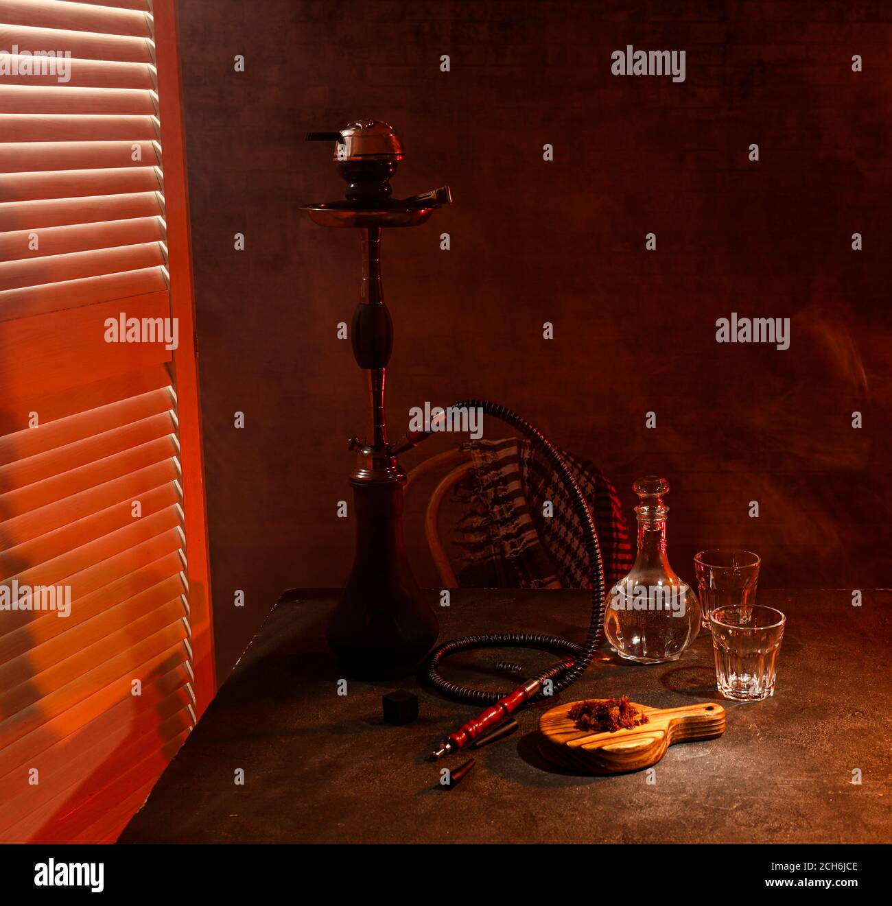 Hookah and alcohol on table Stock Photo - Alamy