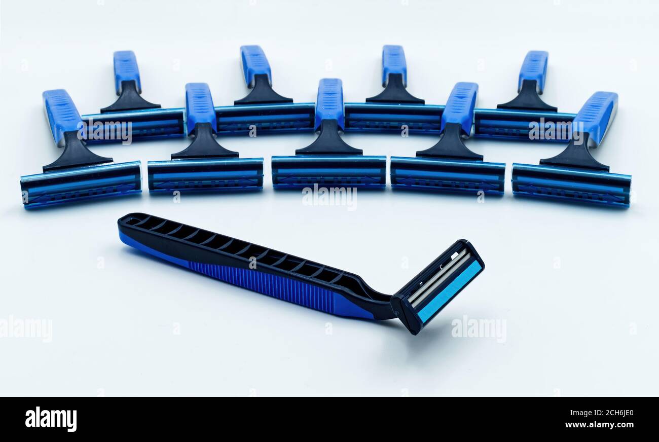 Blue razor with set of razors on background. Selective focus Stock ...