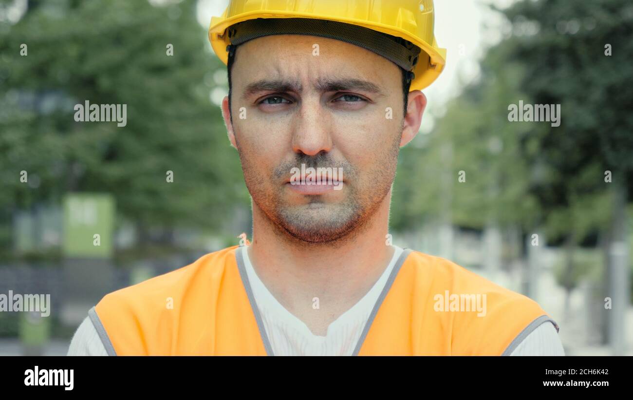 Serious confident construction worker looking co camera Stock Photo - Alamy
