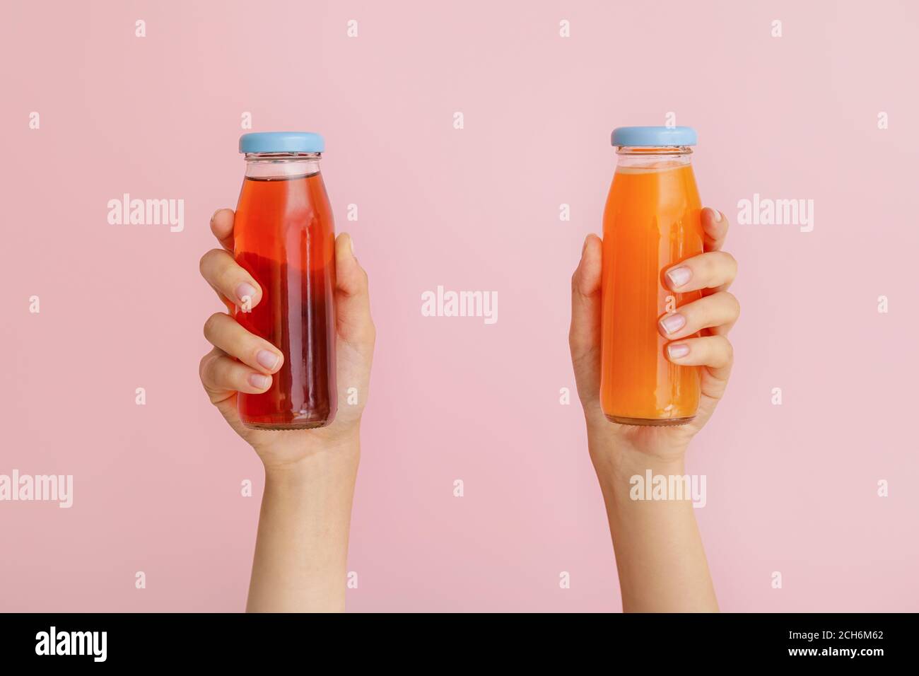 Female hands bottles juices hi-res stock photography and images - Alamy