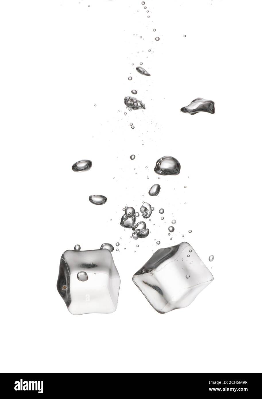 Falling of ice cubes into water on white background Stock Photo - Alamy