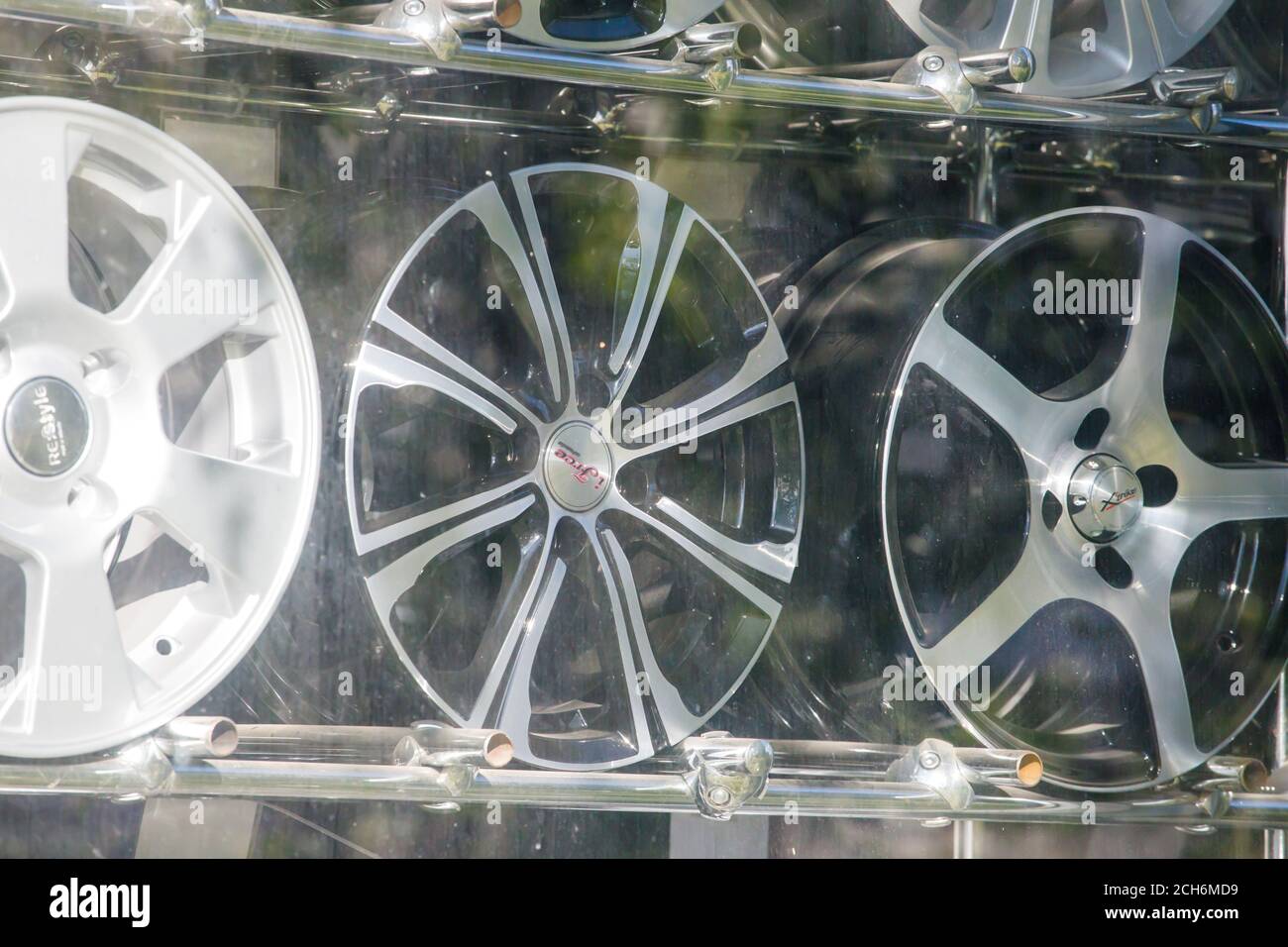 Russia Vyborg. 09.09.2020 Car rims in the shop window behind the glass ...