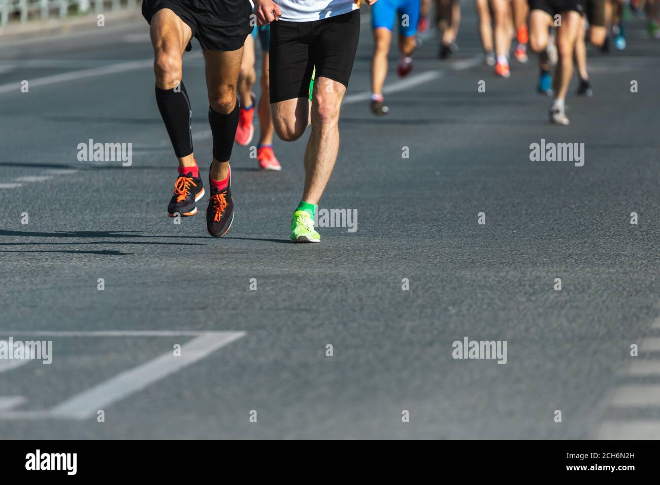 A close-up of the legs of the running track and field athletes on the ...
