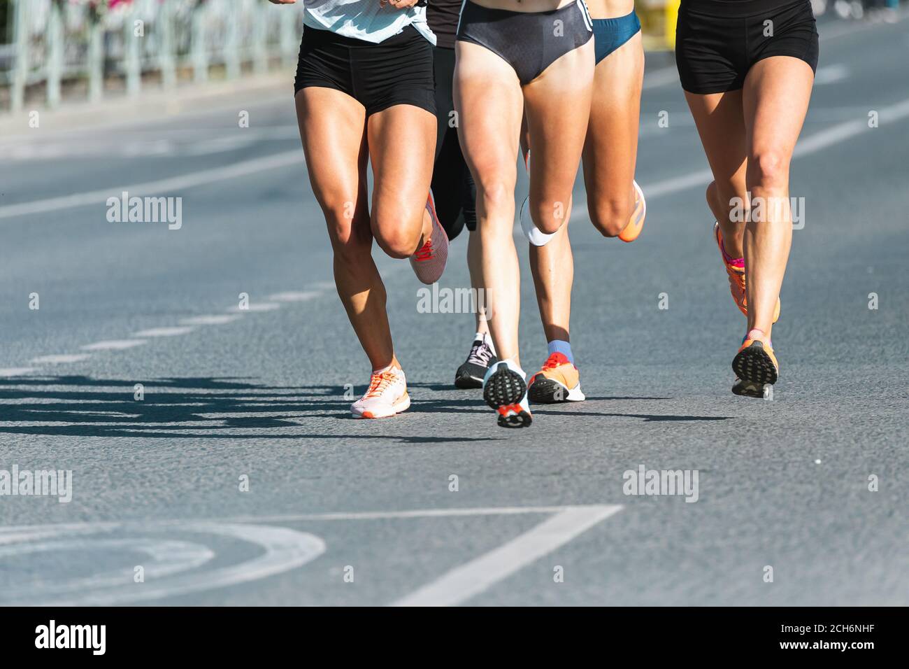 A close-up of the legs of the running track and field athletes on the ...