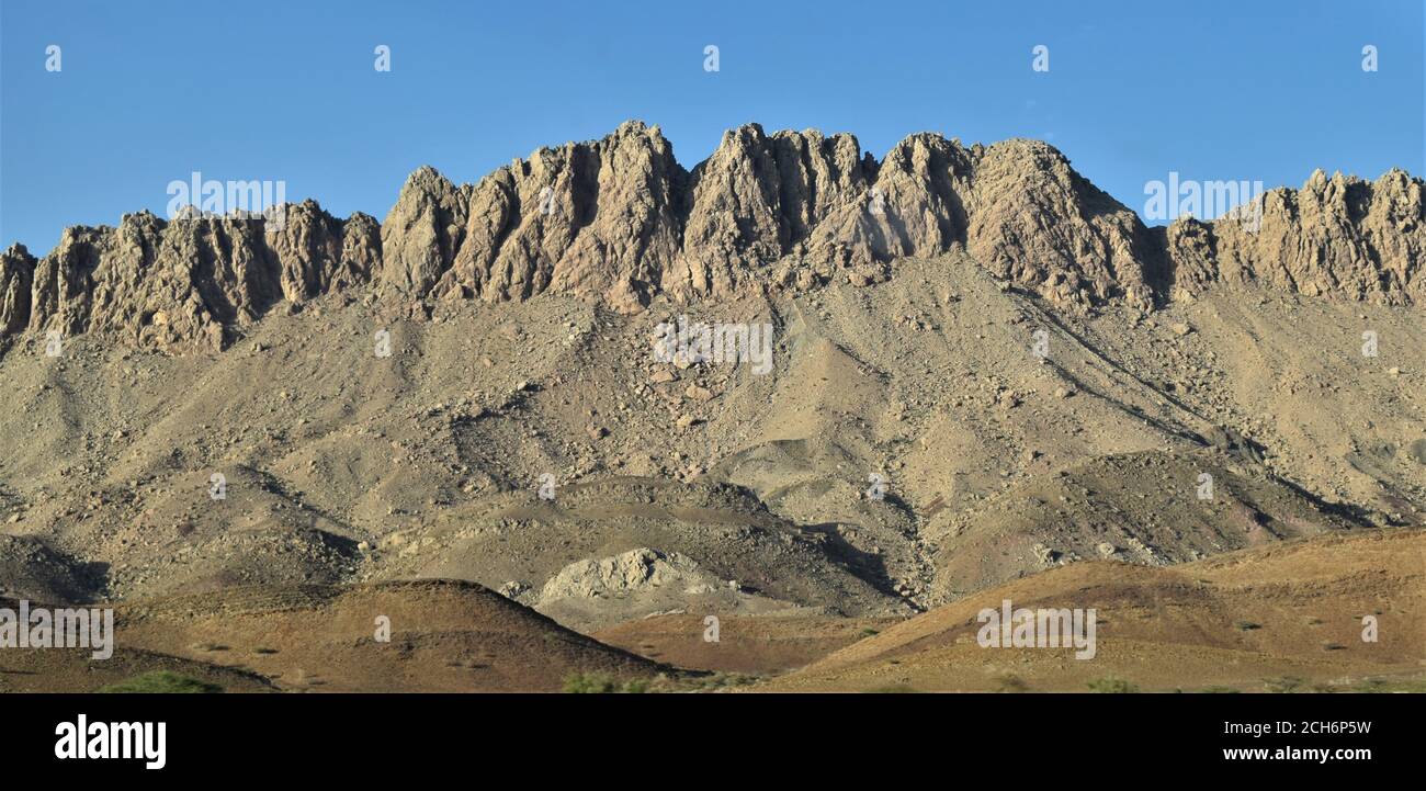 Landscape view of the sharp mountain under blue sky. Muscat, Oman Stock ...