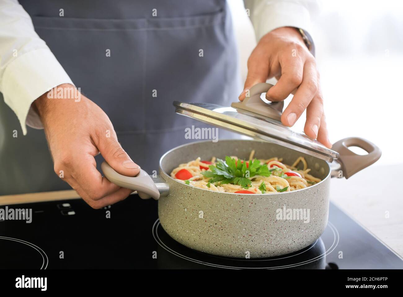 Closeup man cooking soup hand hi-res stock photography and images - Alamy