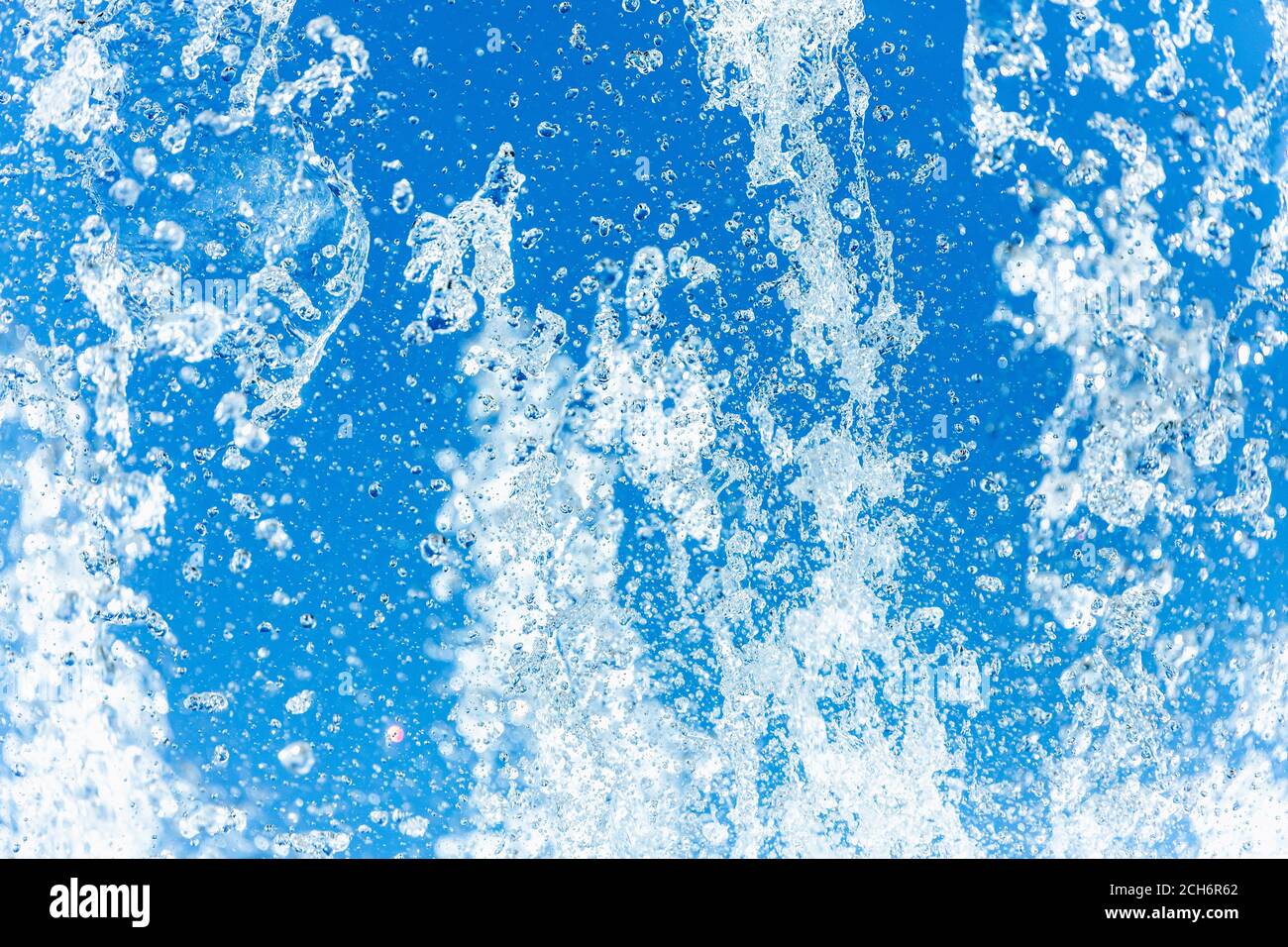 Close up of a water drops on a blue gradient background, covered with ...