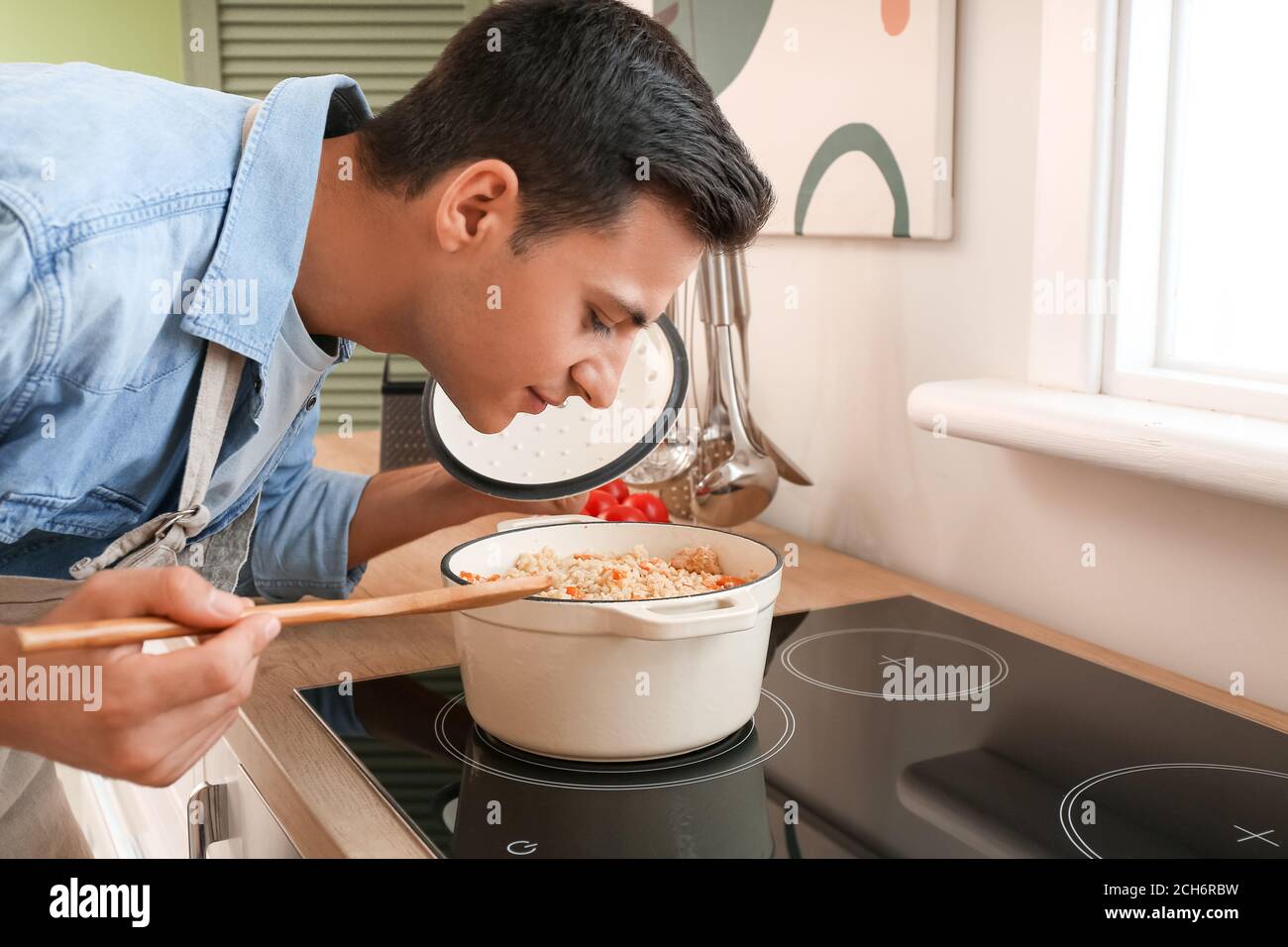 Rice boiling in saucepan hi-res stock photography and images - Alamy
