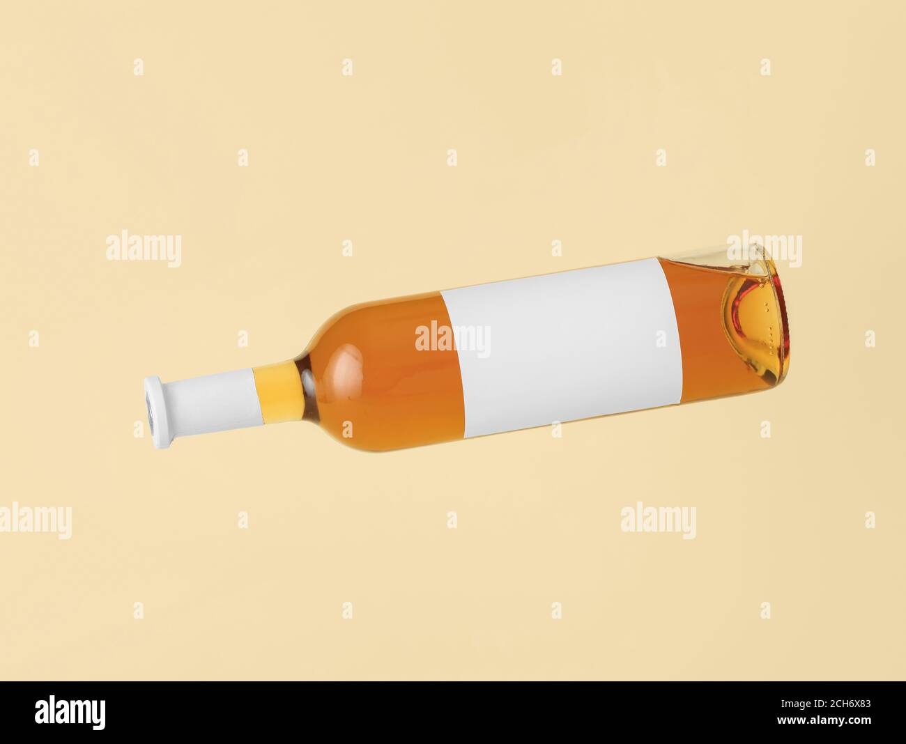 Bottle of wine with blank label on color background. Mockup for design ...