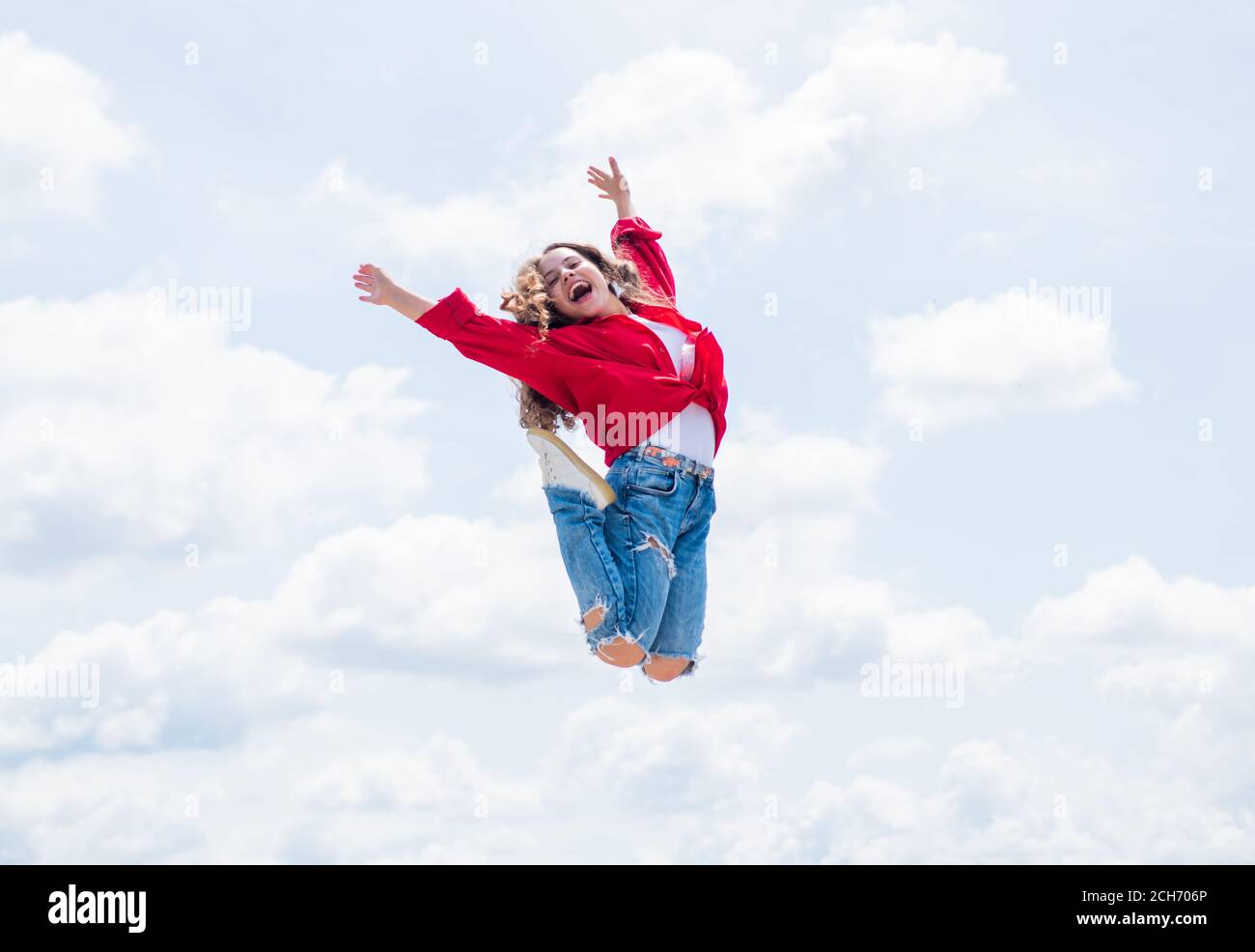 kid jump outdoor. kid fashion and beauty. sense of freedom. portrait of ...