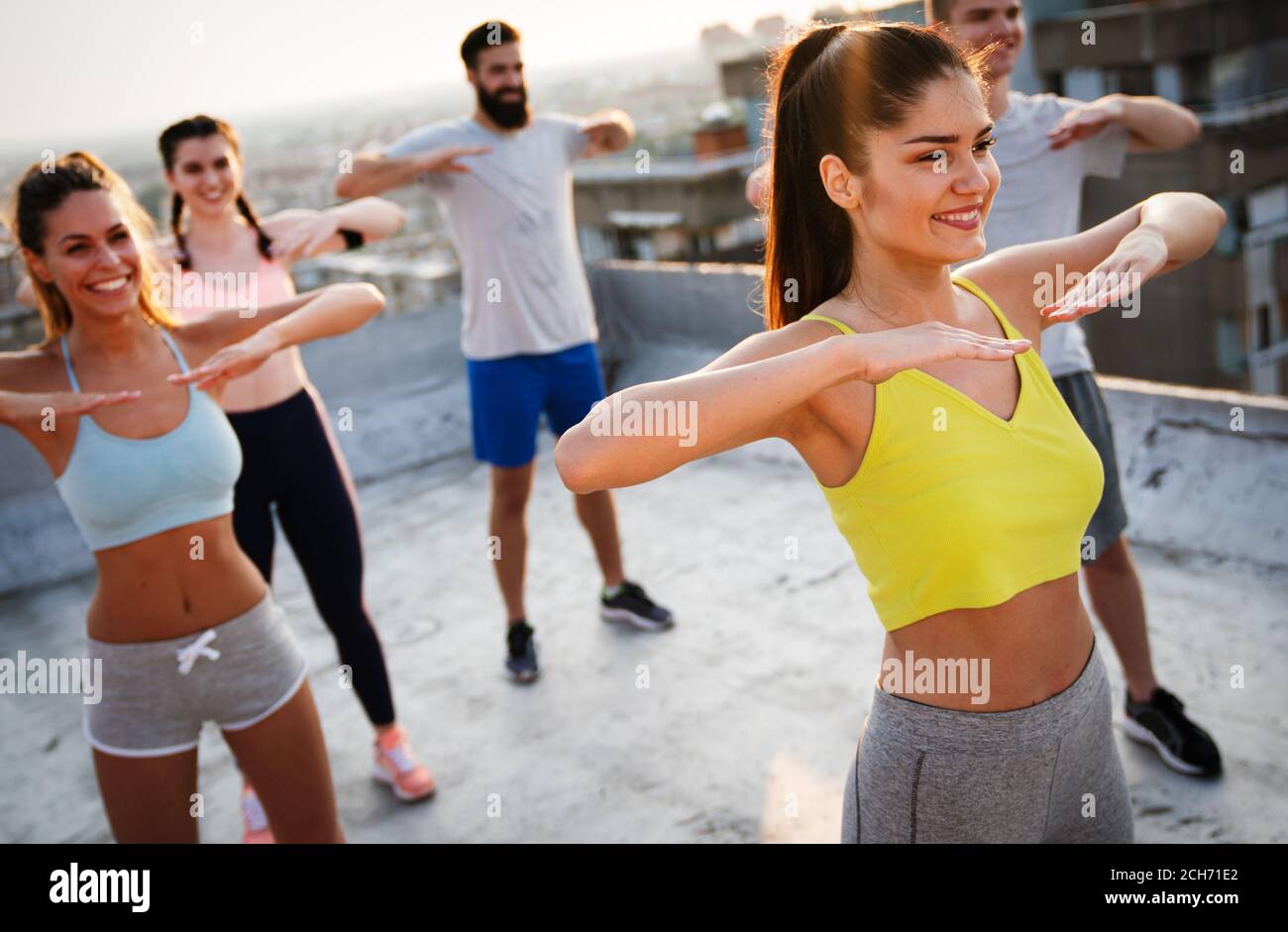 Fitness, sport, training and lifestyle concept. Group of smiling people ...