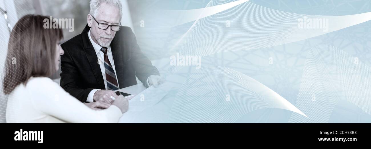 Financial consultant giving advices to female client, light effect ...